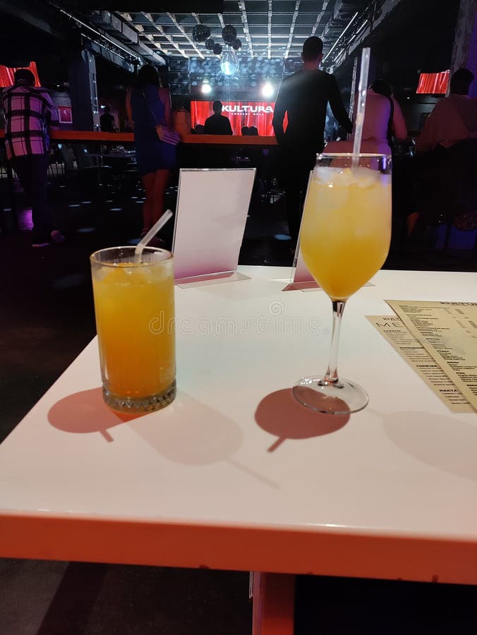 Two Cocktails Orange on a Table Stock Photo - Image of table, orange ...