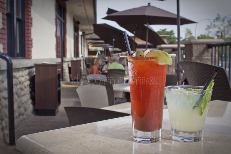 Two Cocktails on Restaurant Patio Stock Image - Image of mojito, spicy ...