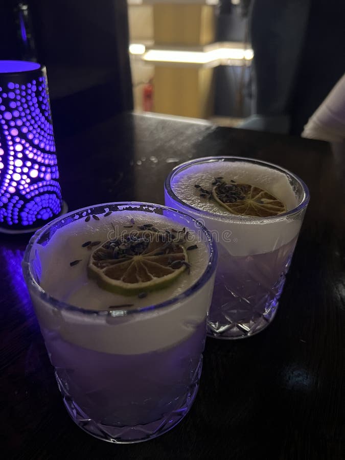 Two cocktails on bar table stock image. Image of beverage - 69531967