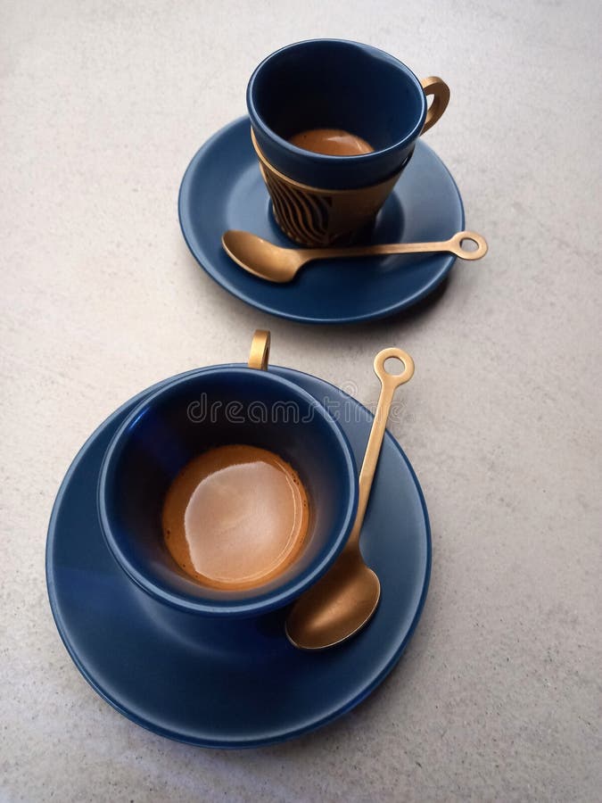 Two coffee cups stock photo. Image of blue, bronze, spoon - 243143408