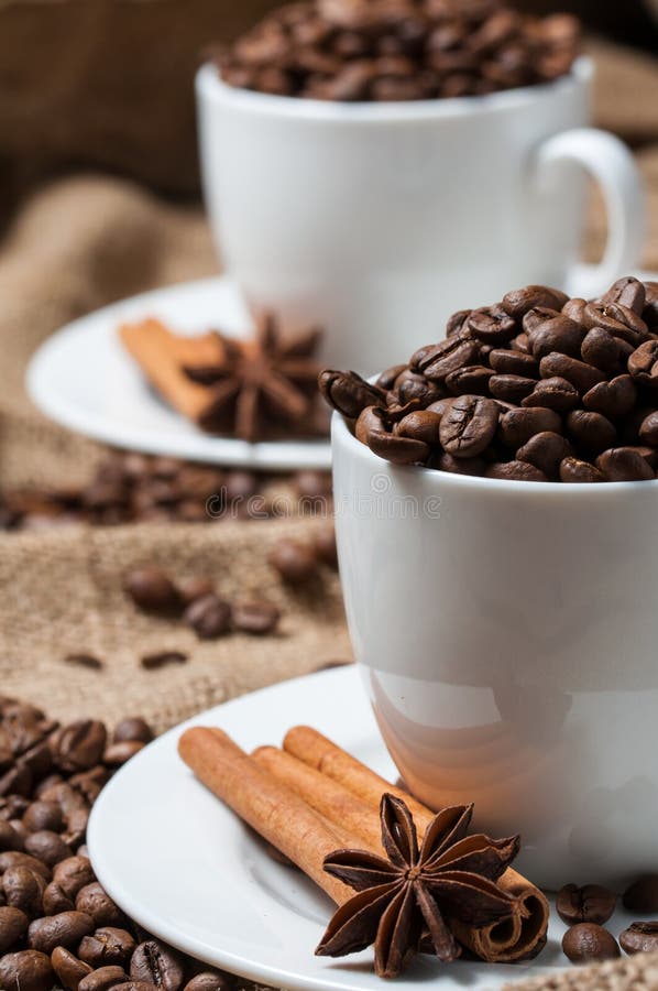Two Coffee Cups with Coffee Beans, Aniseed and Cinnamon. Stock Photo ...