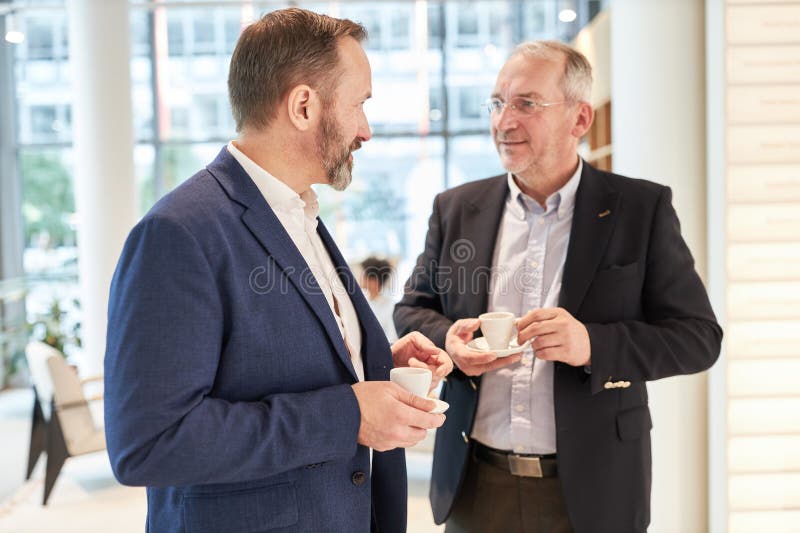 Two Colleagues or Business Partners Having Small Talk Stock Photo ...