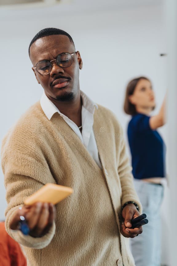 Two Colleagues Collaborate in a Modern Office Setting, Brainstorming ...