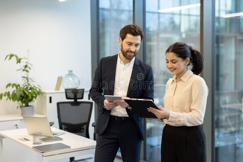 Two Colleagues Collaborate Project Modern Office Reviewing Documents ...