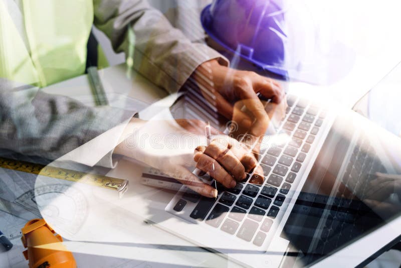 Two Colleagues Discussing Data Working and Tablet, Laptop with on on ...