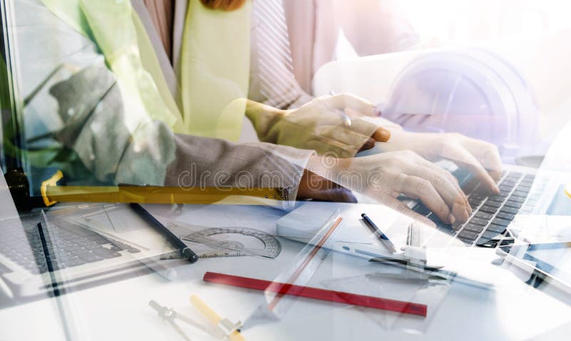 Two Colleagues Discussing Data Working and Tablet, Laptop with on on ...