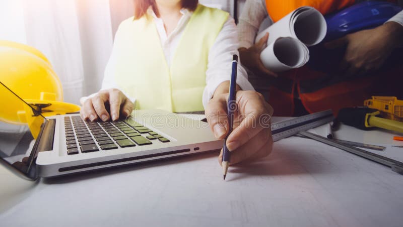 Two Colleagues Discussing Data Working and Tablet, Laptop with on on ...