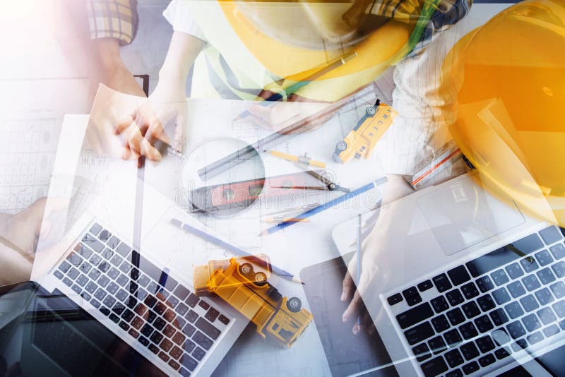 Two Colleagues Discussing Data Working and Tablet, Laptop with on on ...