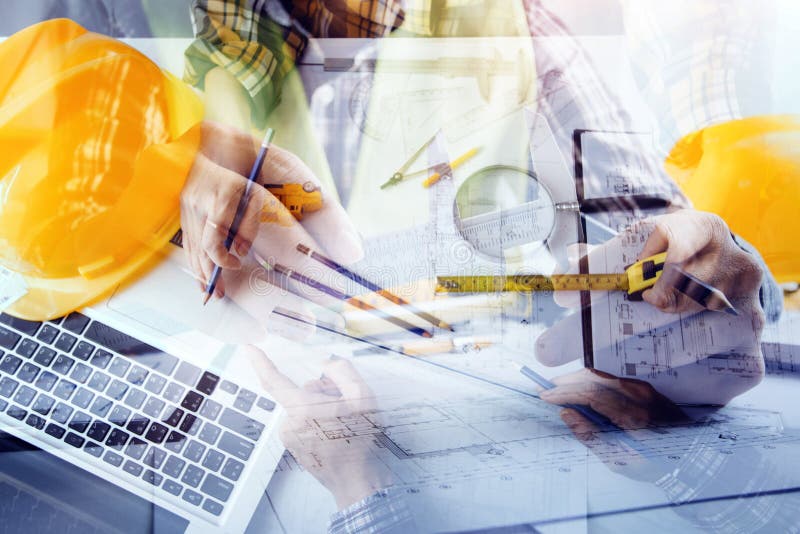 Two Colleagues Discussing Data Working and Tablet, Laptop with on on ...