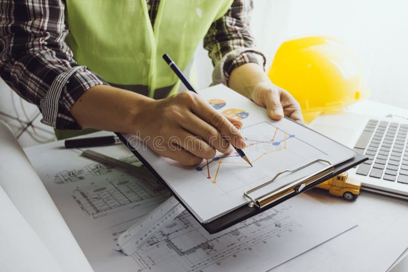 Two Colleagues Discussing Data Working and Tablet, Laptop with on on ...