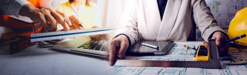 Two Colleagues Discussing Data Working and Tablet, Laptop with on on ...