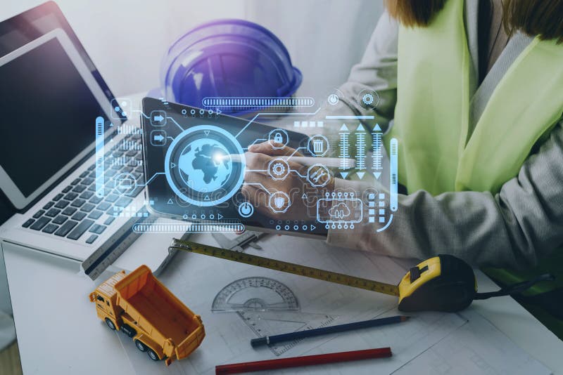 Two Colleagues Discussing Data Working and Tablet, Laptop with on on ...