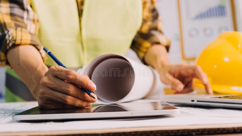 Two Colleagues Discussing Data Working and Tablet, Laptop with on on ...