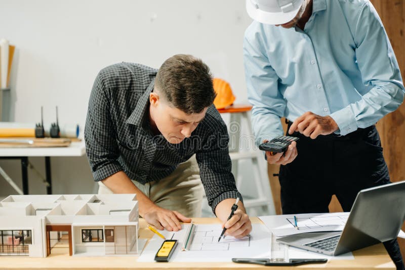 Two Colleagues Discussing Data Working and Tablet, Laptop with ...