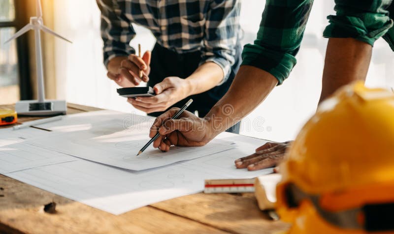 Two Colleagues Discussing Data Working and Tablet, Laptop with on on ...