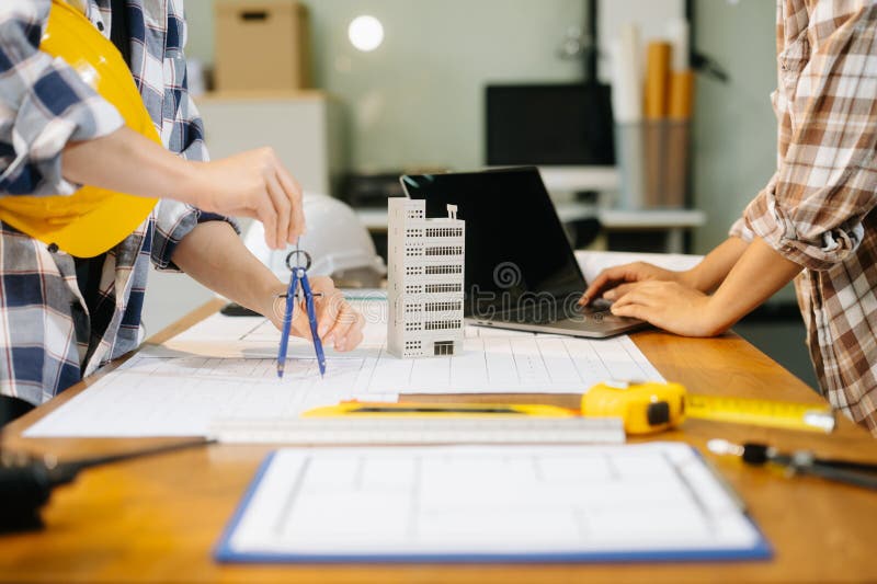 Two Colleagues Discussing Data Working and Tablet, Laptop with ...