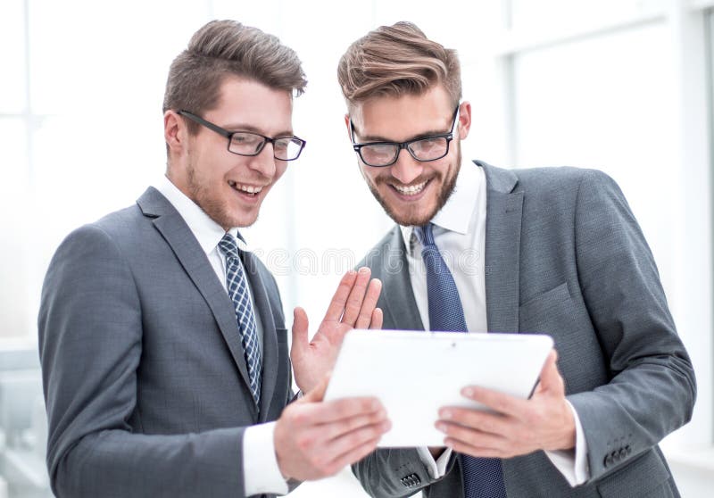 Two Colleagues Discussing Information from a Digital Tablet Stock Photo ...