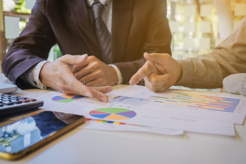 Two Colleagues Discussing about New Business Project Plan on Off Stock ...