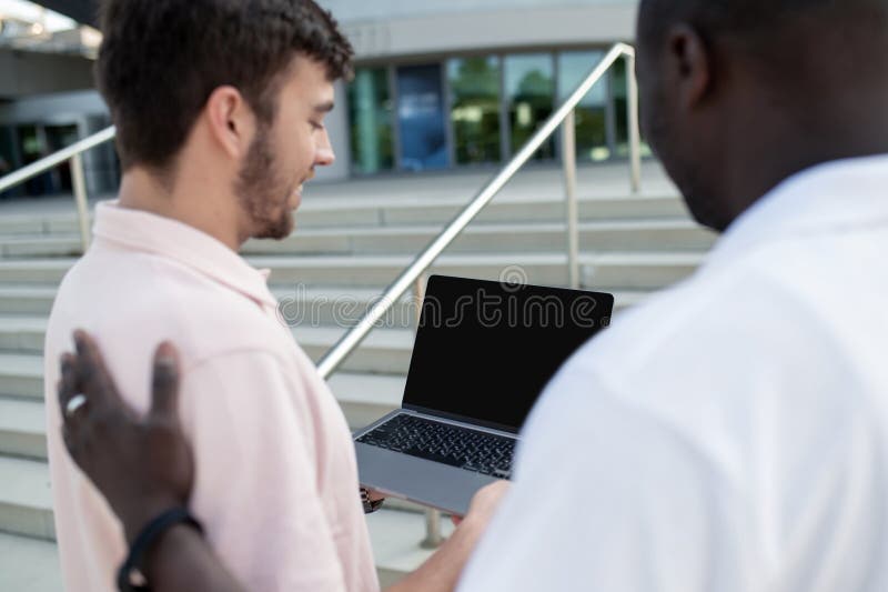 Two Colleagues Discussing Project Details and Looking Interested Stock ...