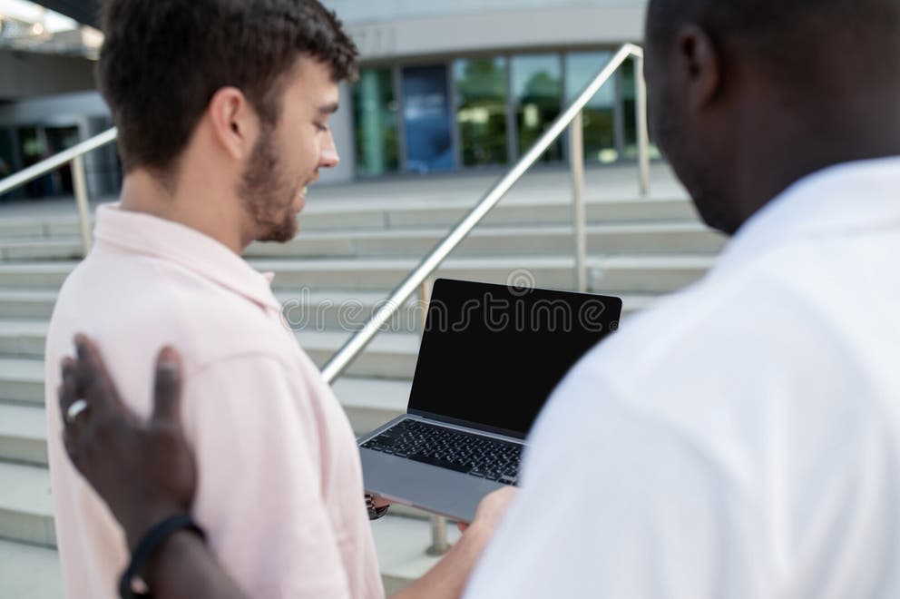 Two Colleagues Discussing Project Details and Looking Interested Stock ...