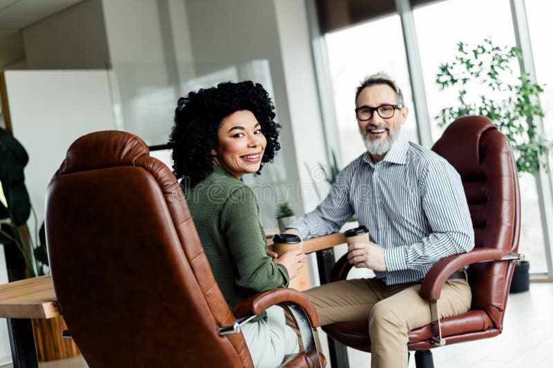 Professional Colleagues Engaged in a Collaborative Office Setting with ...