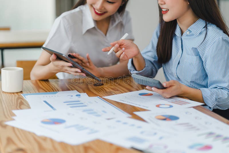 Two Colleagues Engaged in Business Analytics, Using Digital Tablets ...