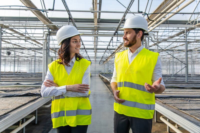 Two Colleagues Engineers Looking Confident while Working Together Stock ...