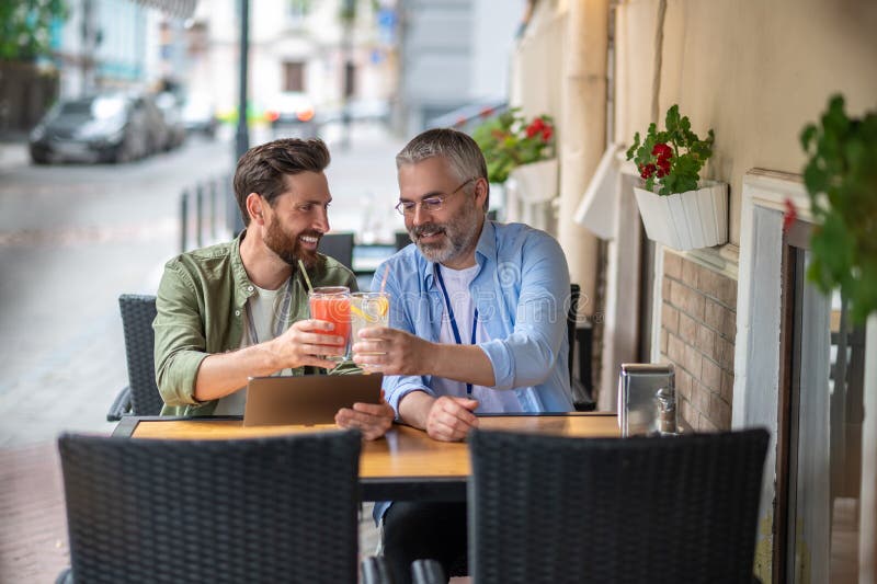 Two Colleagues Having Dinner and Looking Contented Stock Photo - Image ...