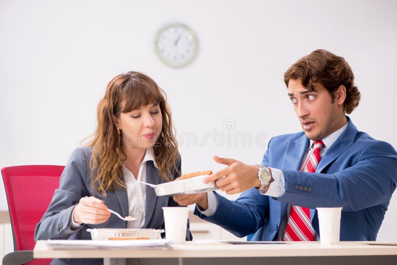 The Two Colleagues Having Lunch Break at Workplace Stock Image - Image ...