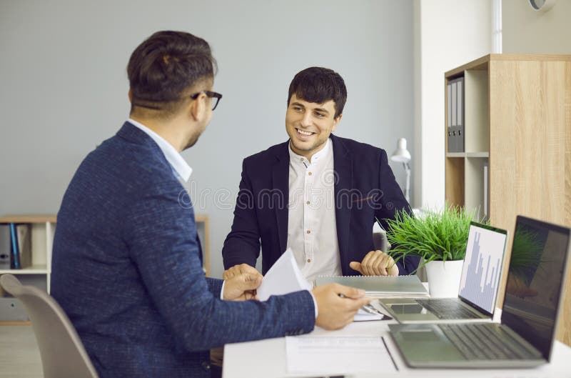 Two Colleagues in Office are Talking Discussing New Project or Task and ...