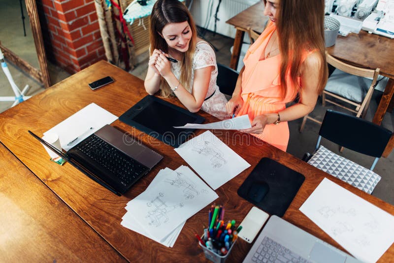 Two Colleagues Sharing Creative Ideas Discussing New Designs in Modern ...