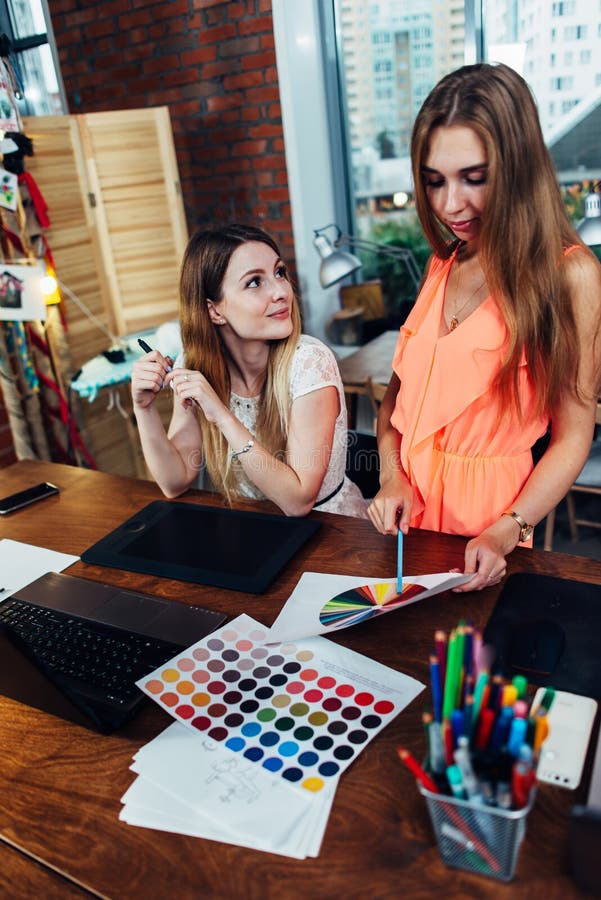 Two Colleagues Sharing Creative Ideas Discussing New Designs in Modern ...