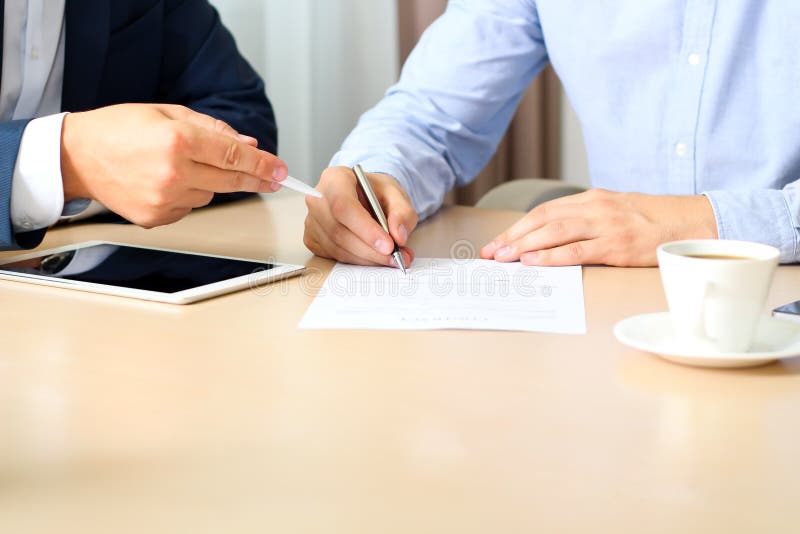 Two Colleagues is Signing a Contract, Business Meeting in the Office ...