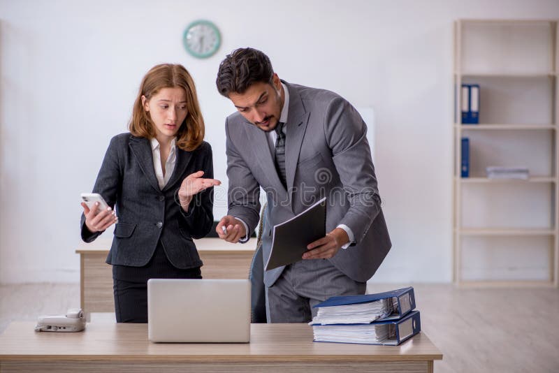 Two Colleagues Working in the Office Stock Photo - Image of contract ...