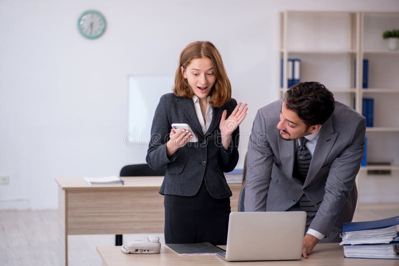 Two Colleagues Working in the Office Stock Image - Image of talking ...