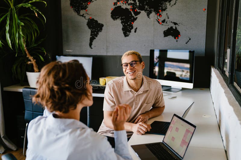 Two Colleagues Talking during Meeting in Modern Workspace Stock Image ...