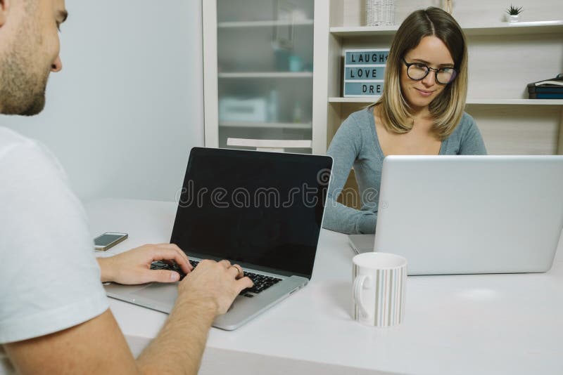 Two Colleagues Working on Laptop Together at Office Stock Photo - Image ...