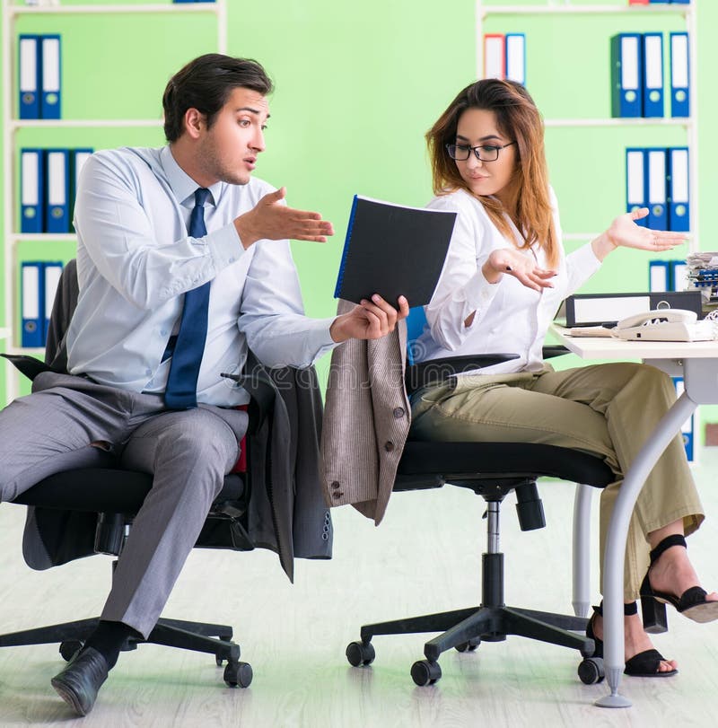 Two Colleagues Working in the Office Stock Image - Image of papers ...