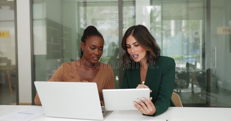 Two Colleagues Working on Presentation Using Laptop and Digital Tablet ...