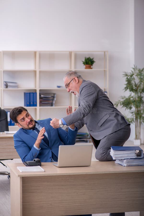 Two Colleagues Working in the Office Stock Photo - Image of bullied ...