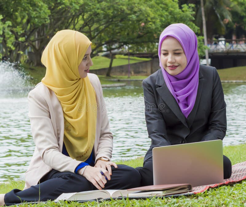 Two College Students Having Discussion and Changing Ideas while Sitting ...