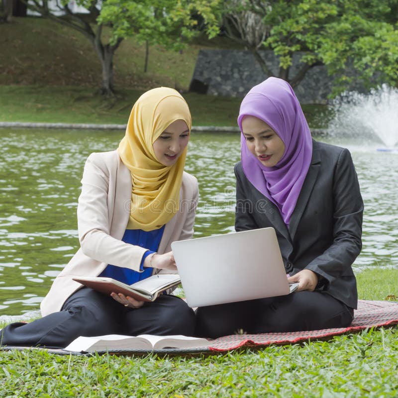 Two College Students Having Discussion and Changing Ideas while Sitting ...