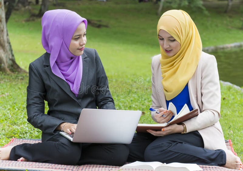 Two College Students Having Discussion and Changing Ideas while Sitting ...