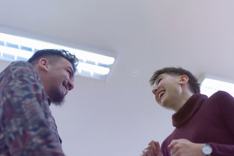 Two College Students Standing in Corridor and Chatting after Their ...