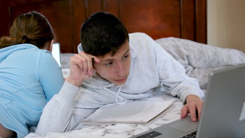 Two College Students Studying Geometry Together in Comfortable Beanbag ...