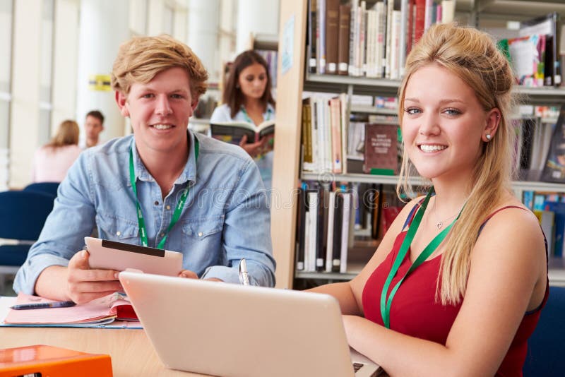 Two College Students Studying in Library Together Stock Image - Image ...