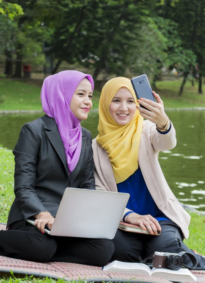 Two College Students Taking Photo in the Park Stock Image - Image of ...