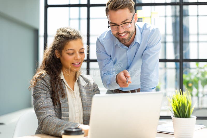 Two Collegues Discussing Documents and Other Working Moments in Office ...