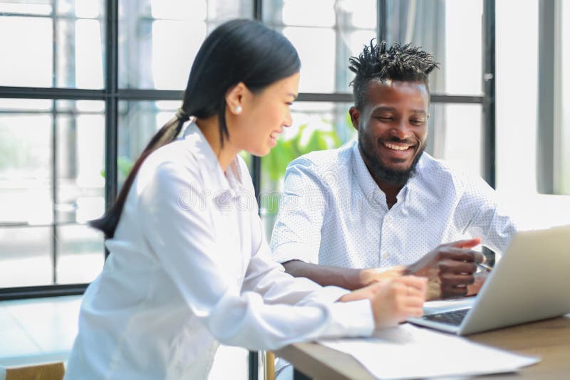 Two Collegues Discussing Documents and Other Working Moments in Office ...