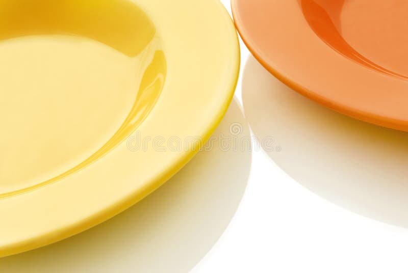 Two color plates stock image. Image of orange, yellow - 4889813